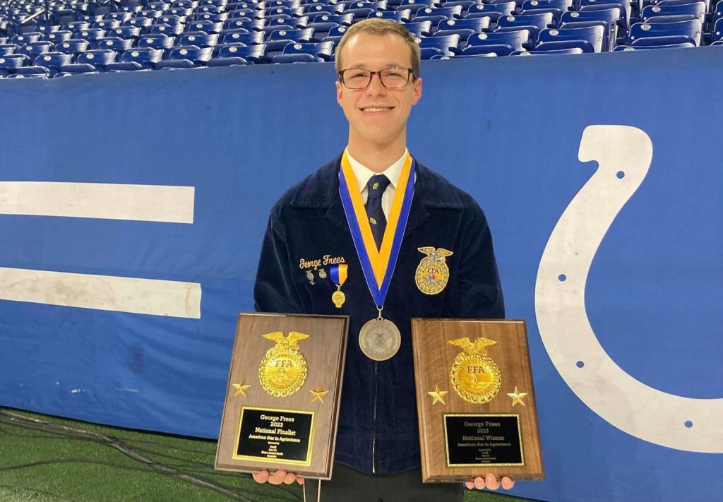 George Frees, senior biochemistry and plant sciences major, receives ...